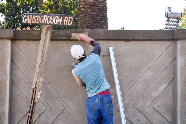 Zimbabwean Construction Worker Renovates a Wall