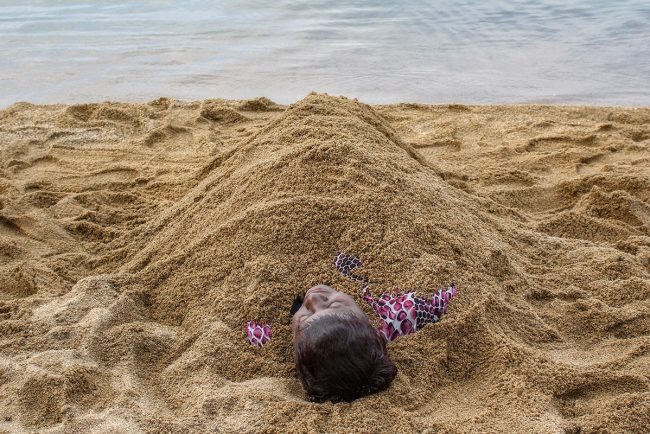 For Rwandan Woman, Beach Sand Brings Relief