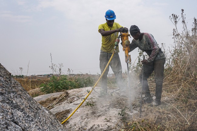 Workers Prepare Land for Development in Zimbabwe