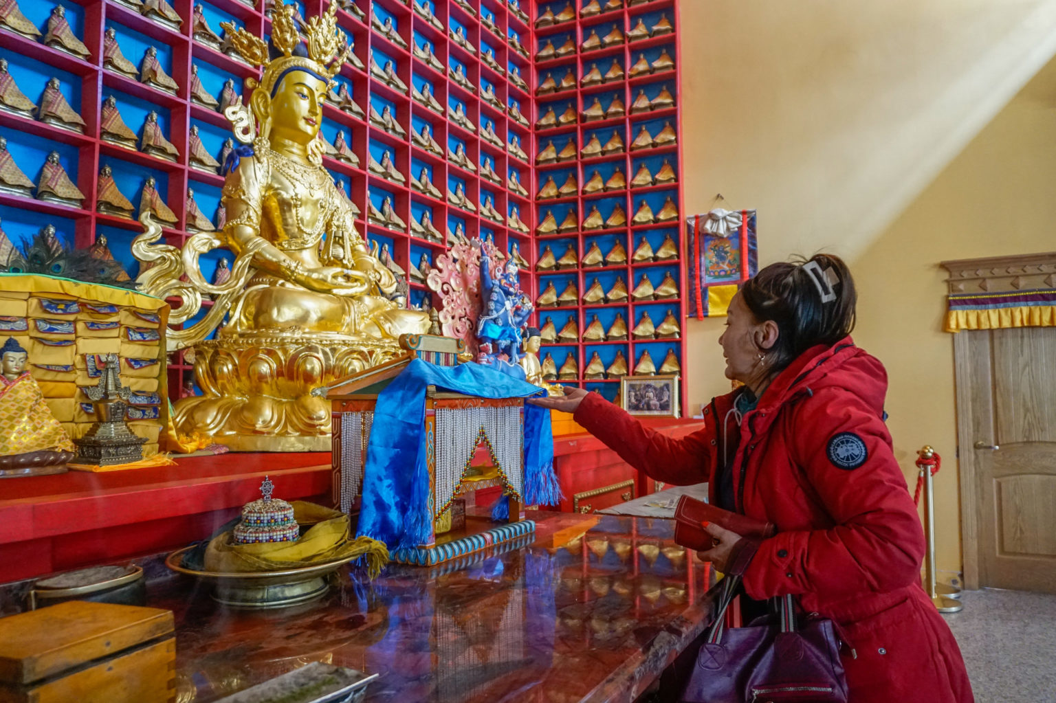 Worshipper Makes Offering at Historic Monastery | Global Press Journal